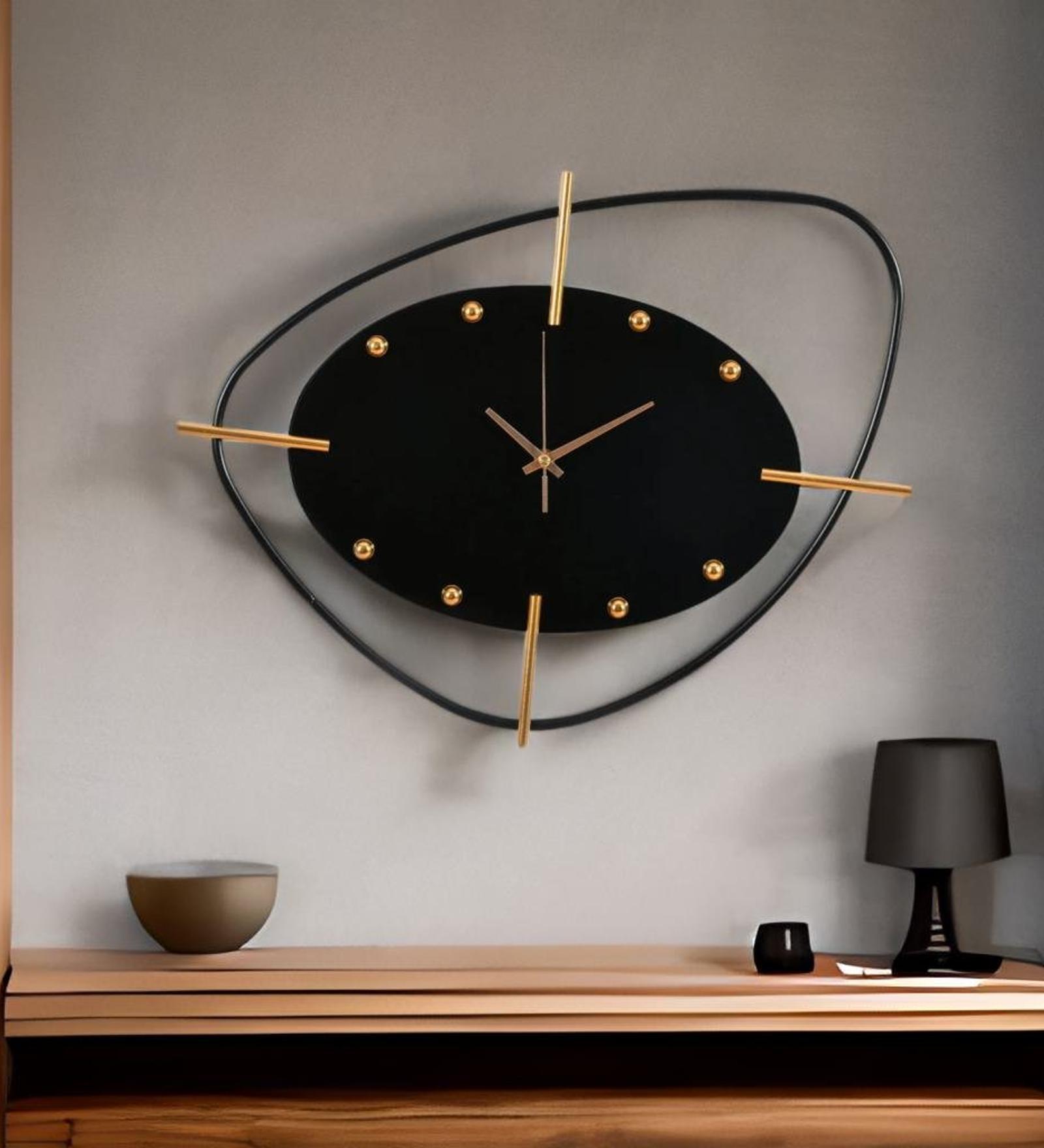 Buy Abstract Pebble Black Metal Wall Clock at 57% OFF by @home | Pepperfry