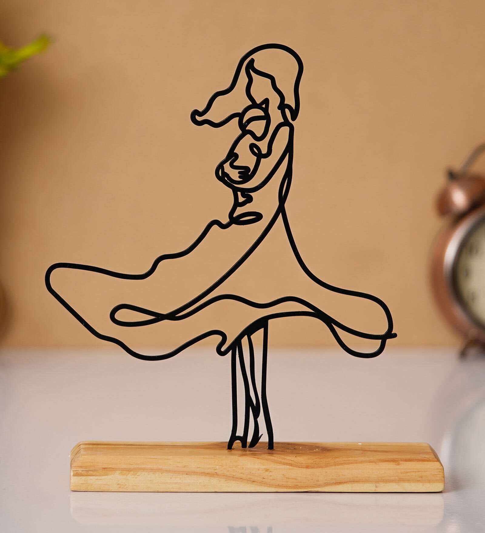 Buy Caring Lady Metal Sculpture at 30% OFF by The Next Decor | Pepperfry