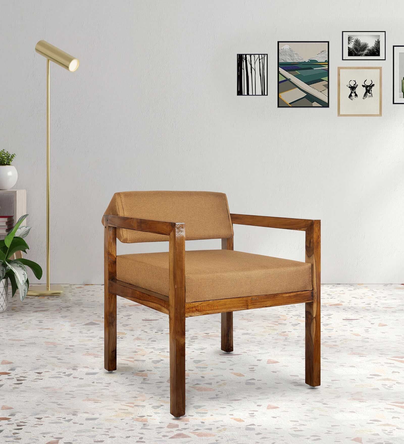 Buy Darlene Arm Chair In Golden Colour at 23% OFF by Timberly | Pepperfry