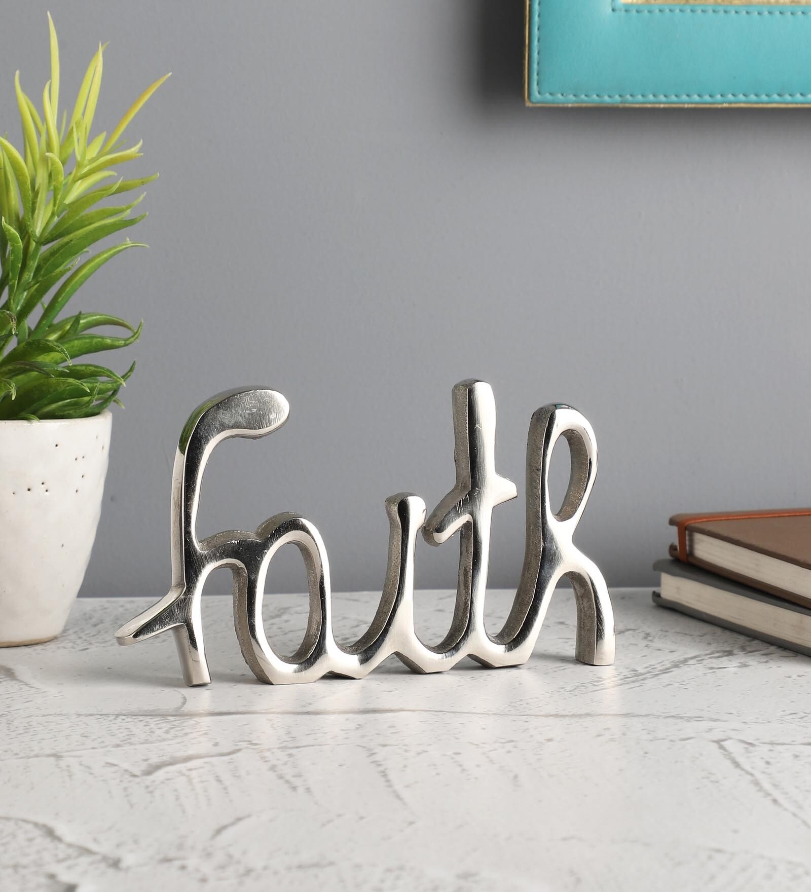Buy Faith Silver Aluminium Showpiece at 19% OFF by Purestory | Pepperfry