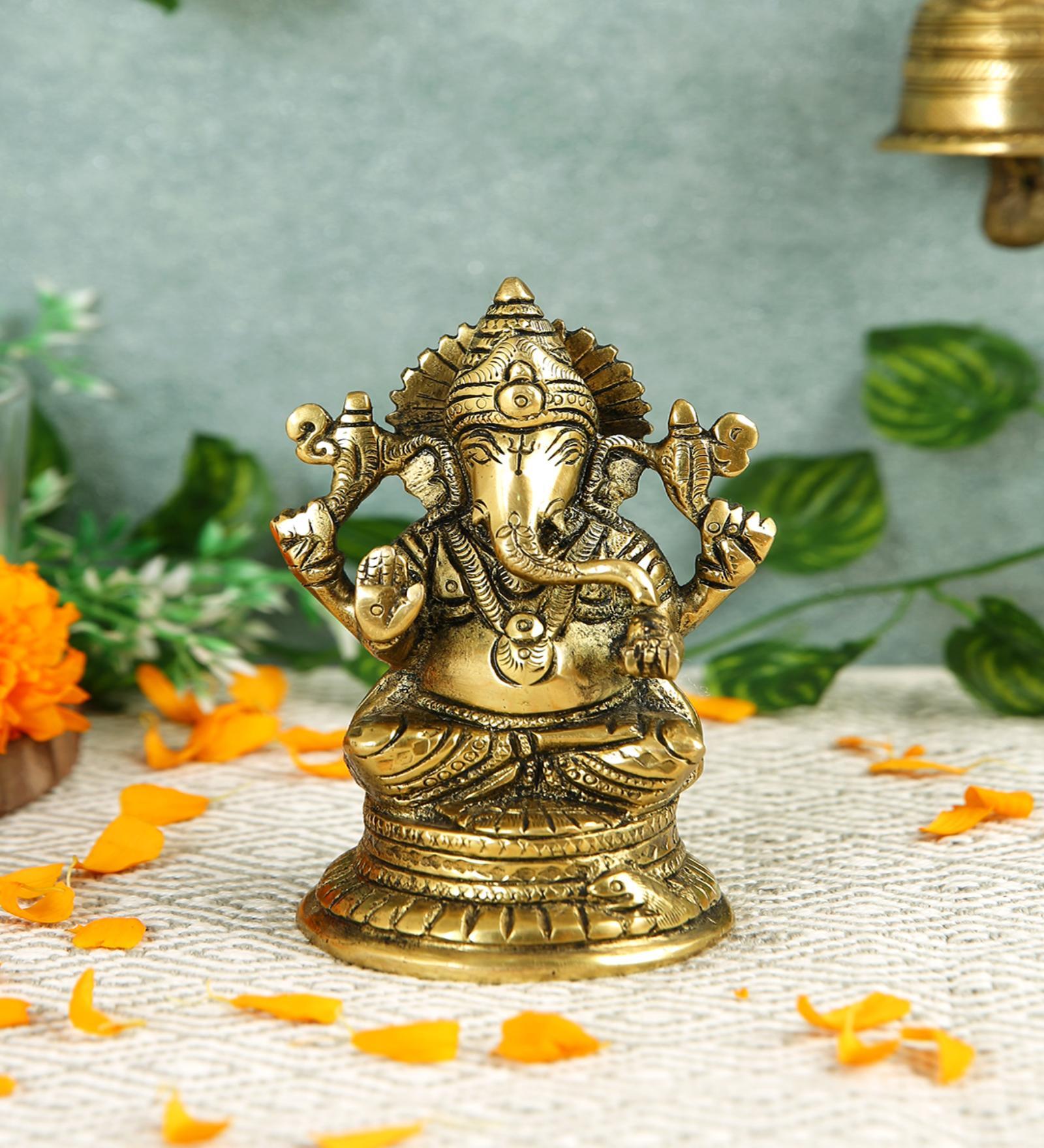 Buy Ganesh Sitting Gold Brass Idol at 23% OFF by Imli street | Pepperfry