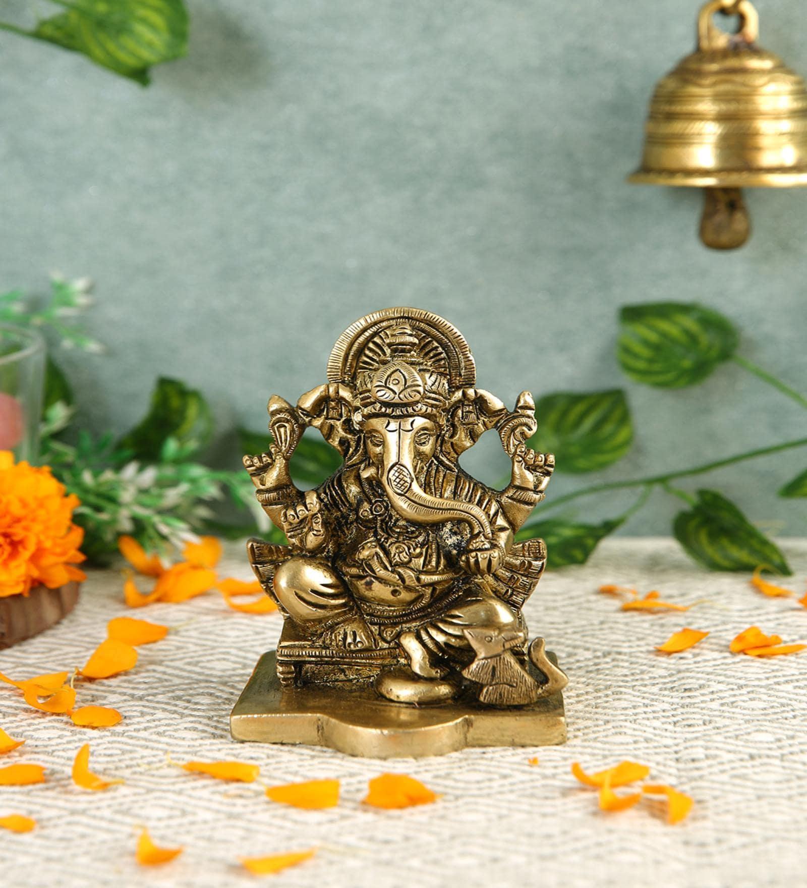 Buy Ganesh Sitting Gold Brass Idol at 26% OFF by Imli street | Pepperfry