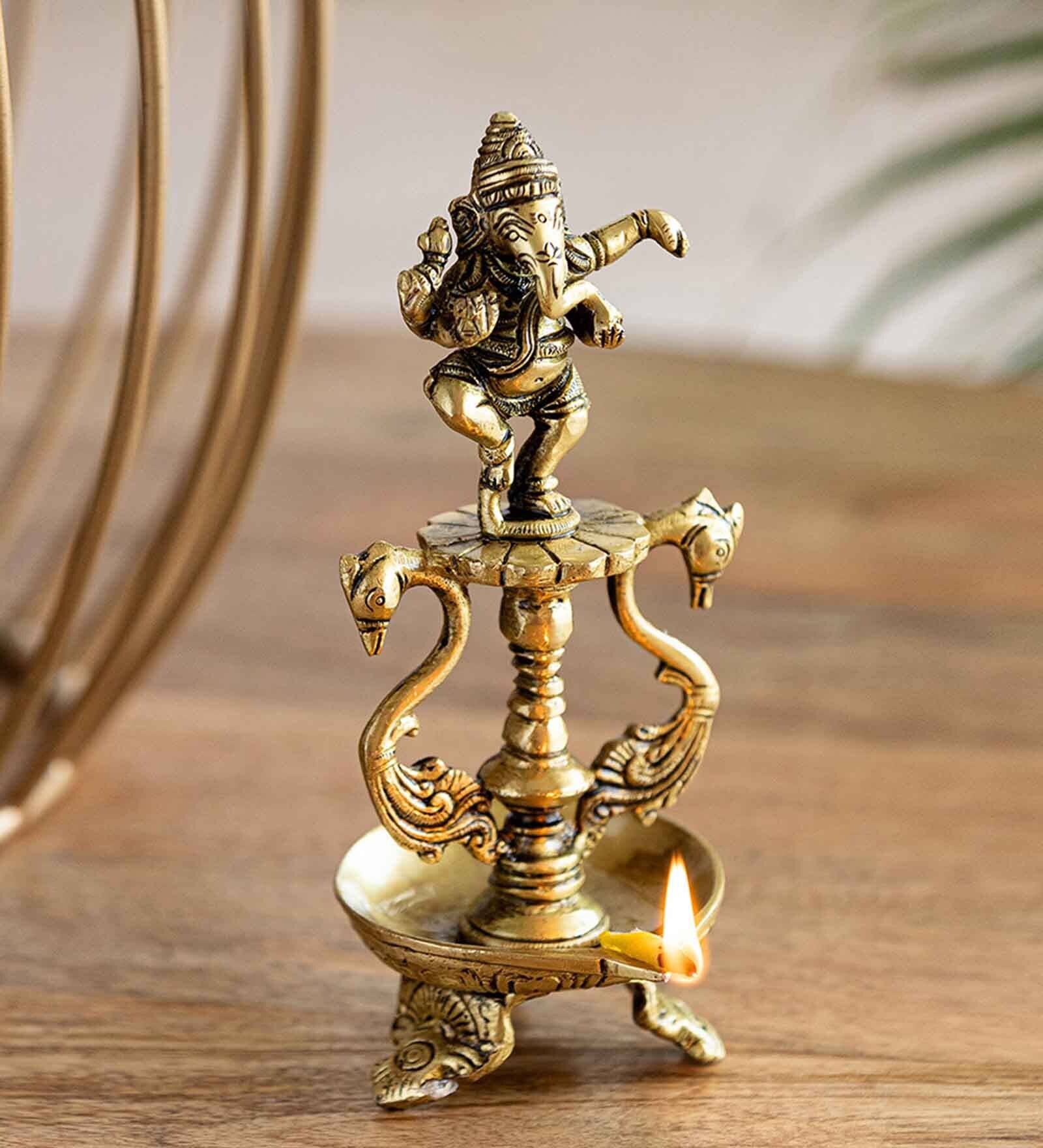 Buy Ganesha Gold Brass Table Diya at 23% OFF by ExclusiveLane | Pepperfry