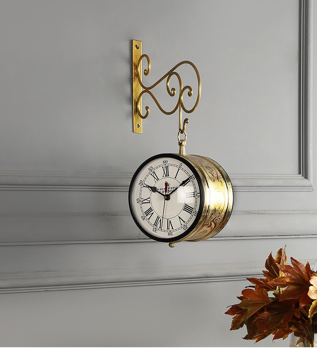 Buy Gold Metal Carving Platform Clock at 25% OFF by Exim Decor | Pepperfry