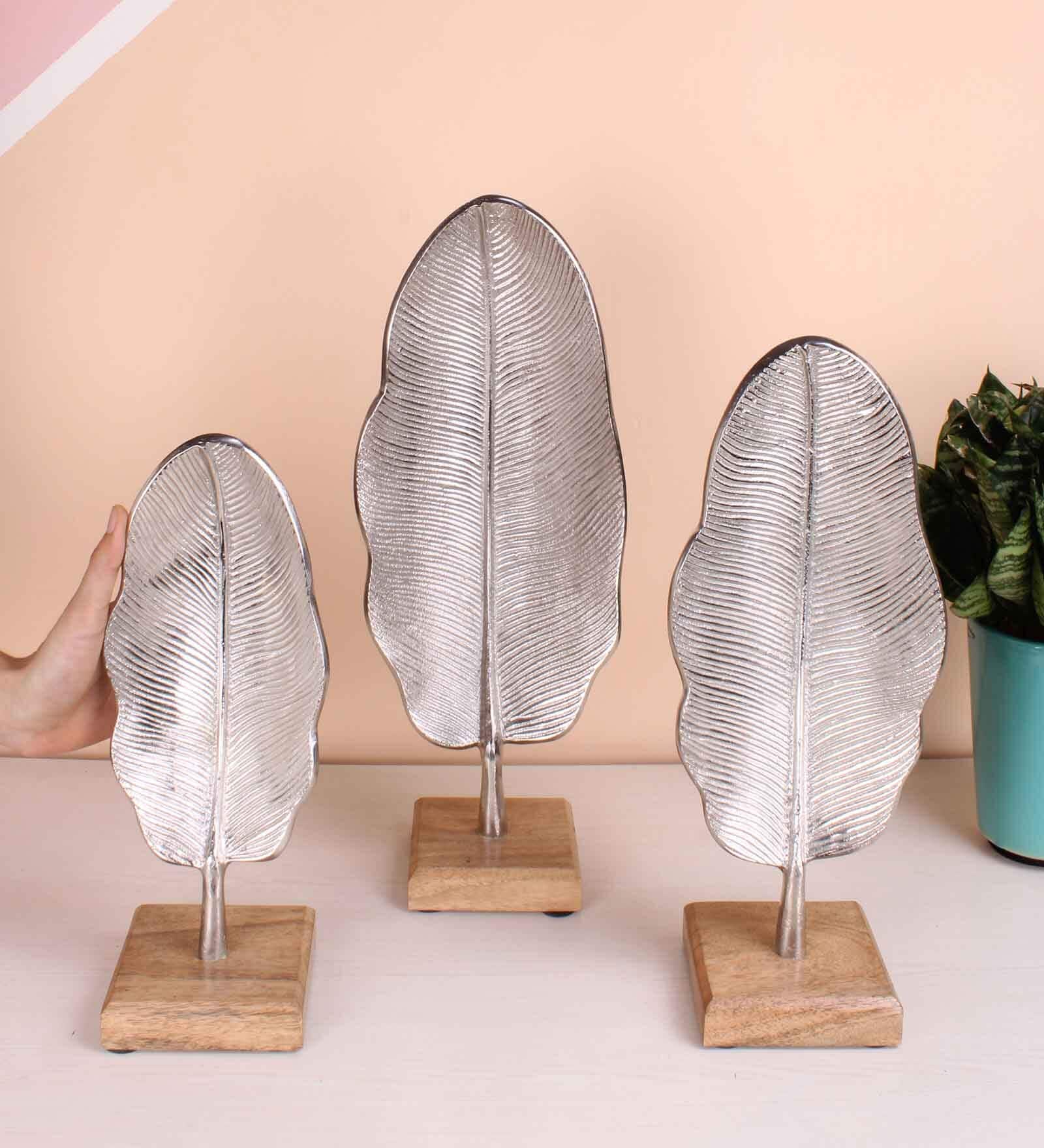 Buy Hazel Leaf Silver Metal Showpiece at 48% OFF by Stitchnest | Pepperfry