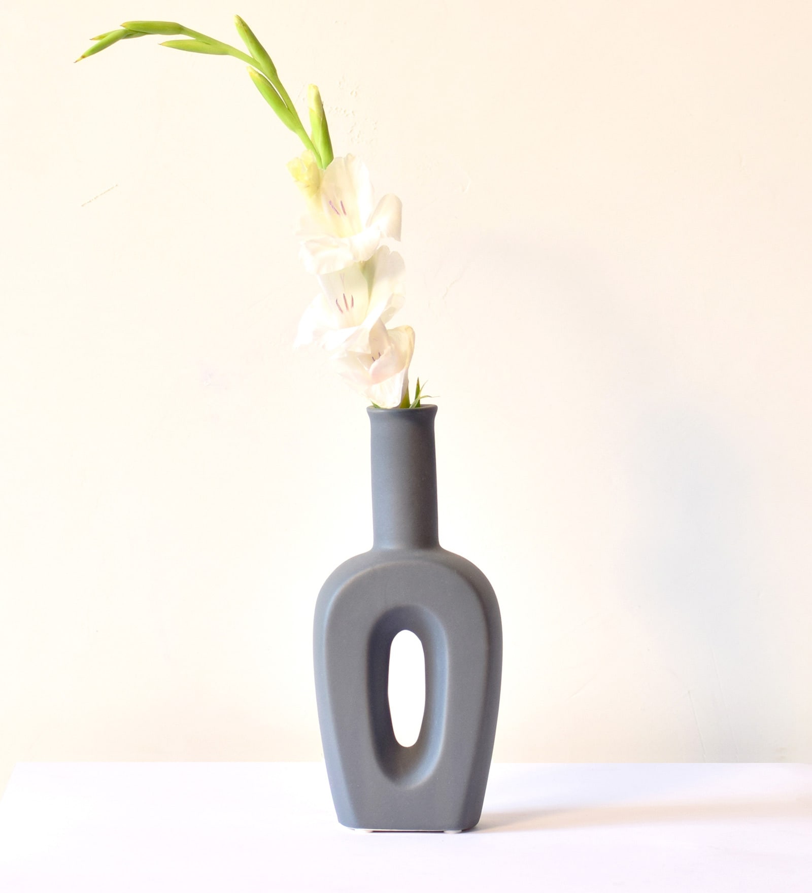 Buy Hollow Adam Linear Ceramic Table Vase at 37% OFF by Morcee | Pepperfry