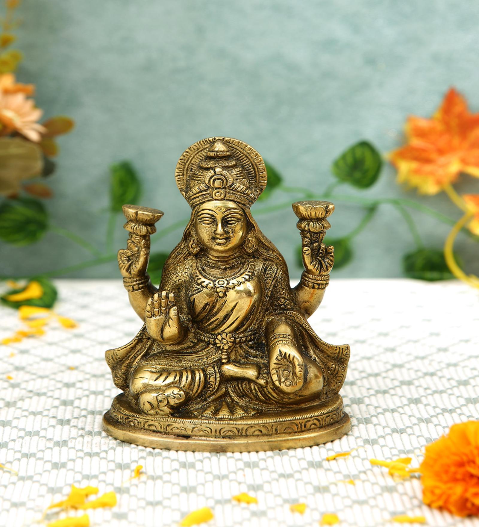 Buy Laxmi Sitting Gold Brass Idol at 20% OFF by Imli street | Pepperfry