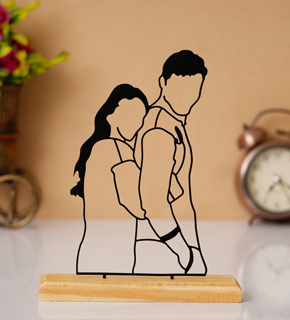 Buy Loving Couple Metal Sculpture at 39% OFF by The Next Decor | Pepperfry