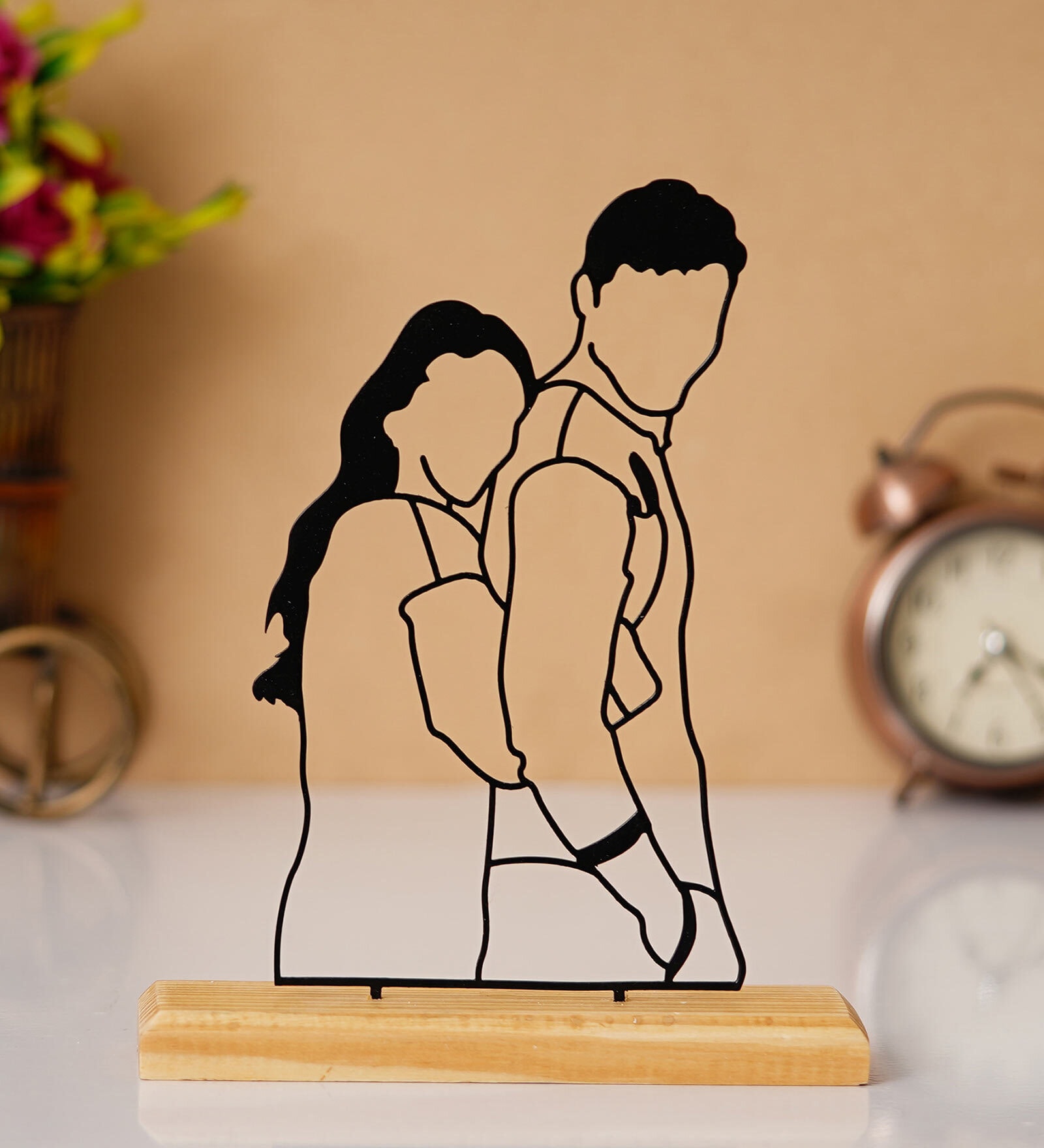 Buy Loving Couple Metal Sculpture at 40% OFF by The Next Decor | Pepperfry