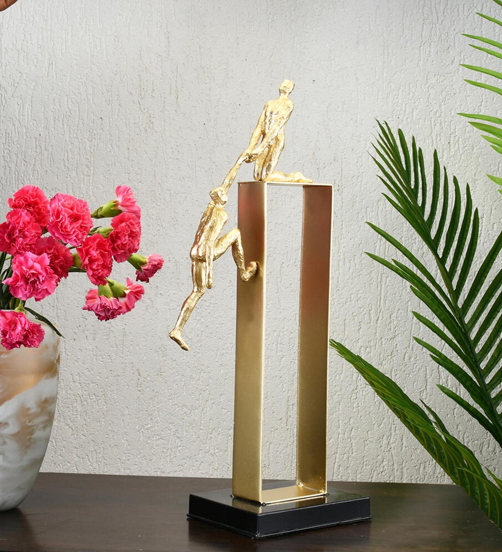 Buy Man Pulling Teammate Black & Gold Polyresin Showpiece at 100% OFF ...