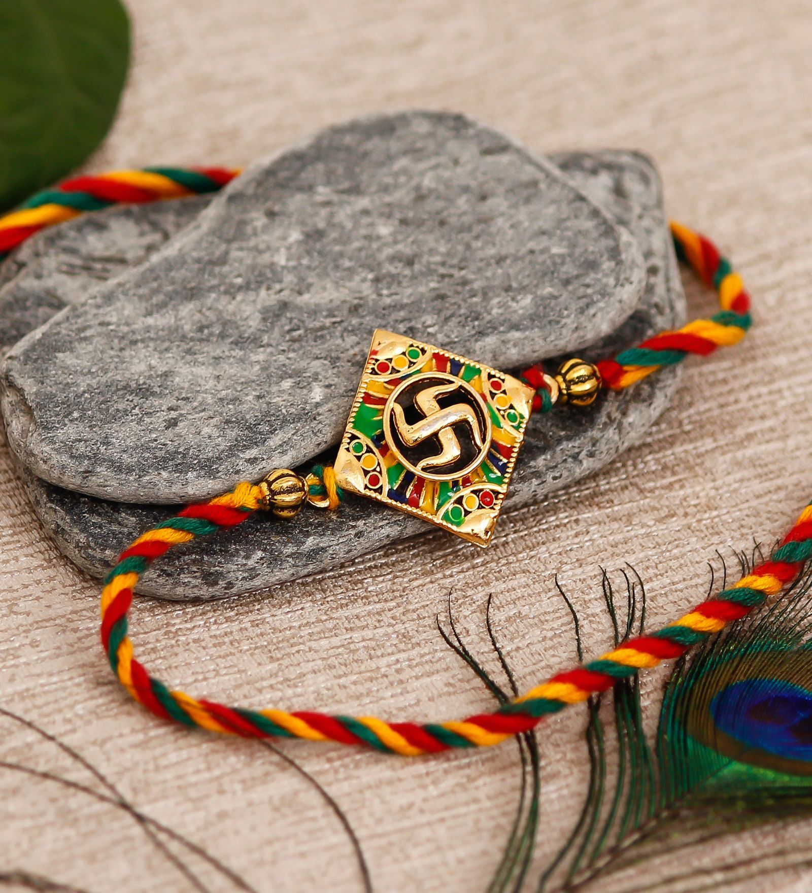 Buy Multicolor Designer Religious Swastik Rakhi with Roli Chawal Pack ...