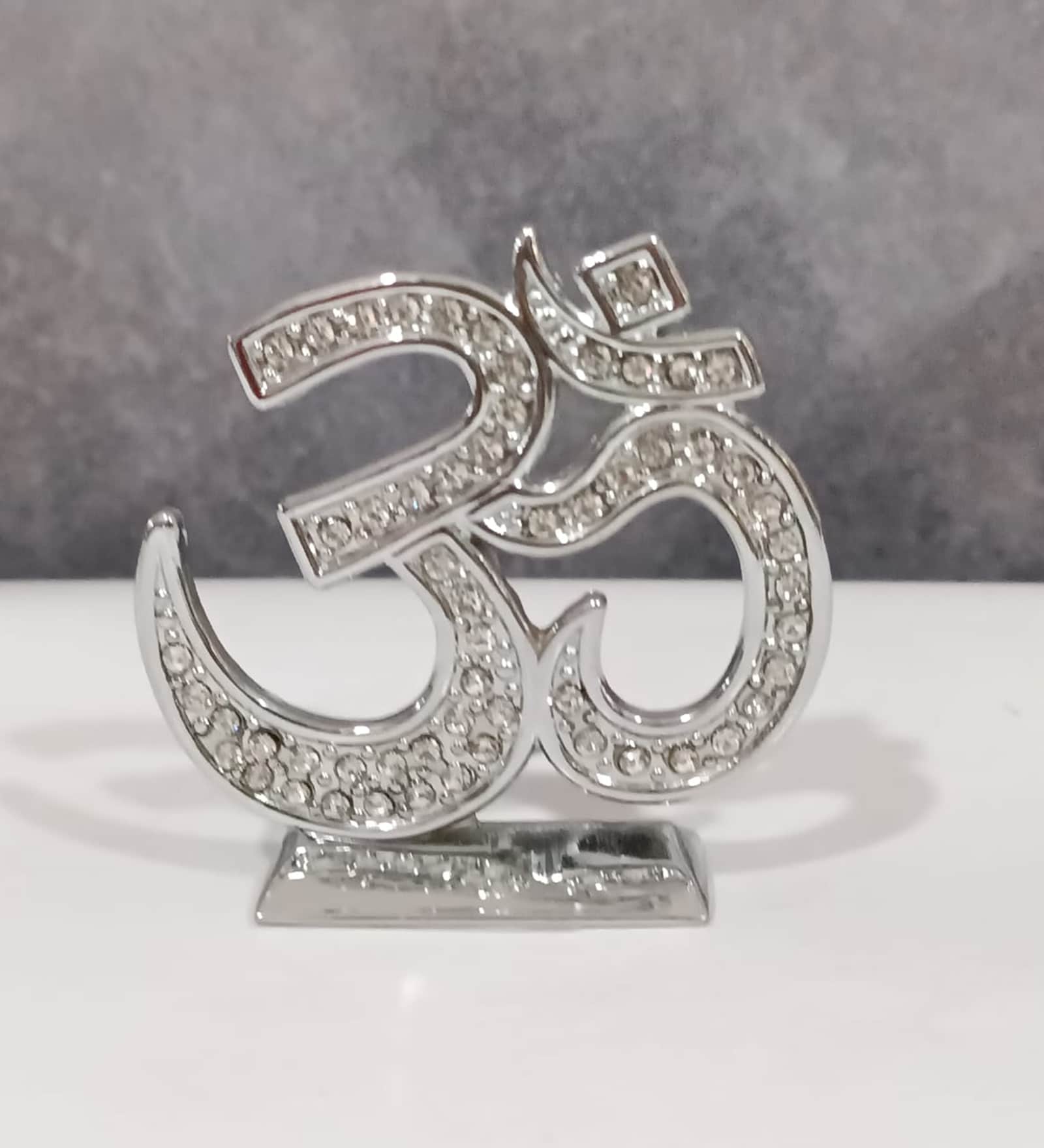 Buy OM Silver Metal Religious Symbol at 20% OFF by Wens | Pepperfry