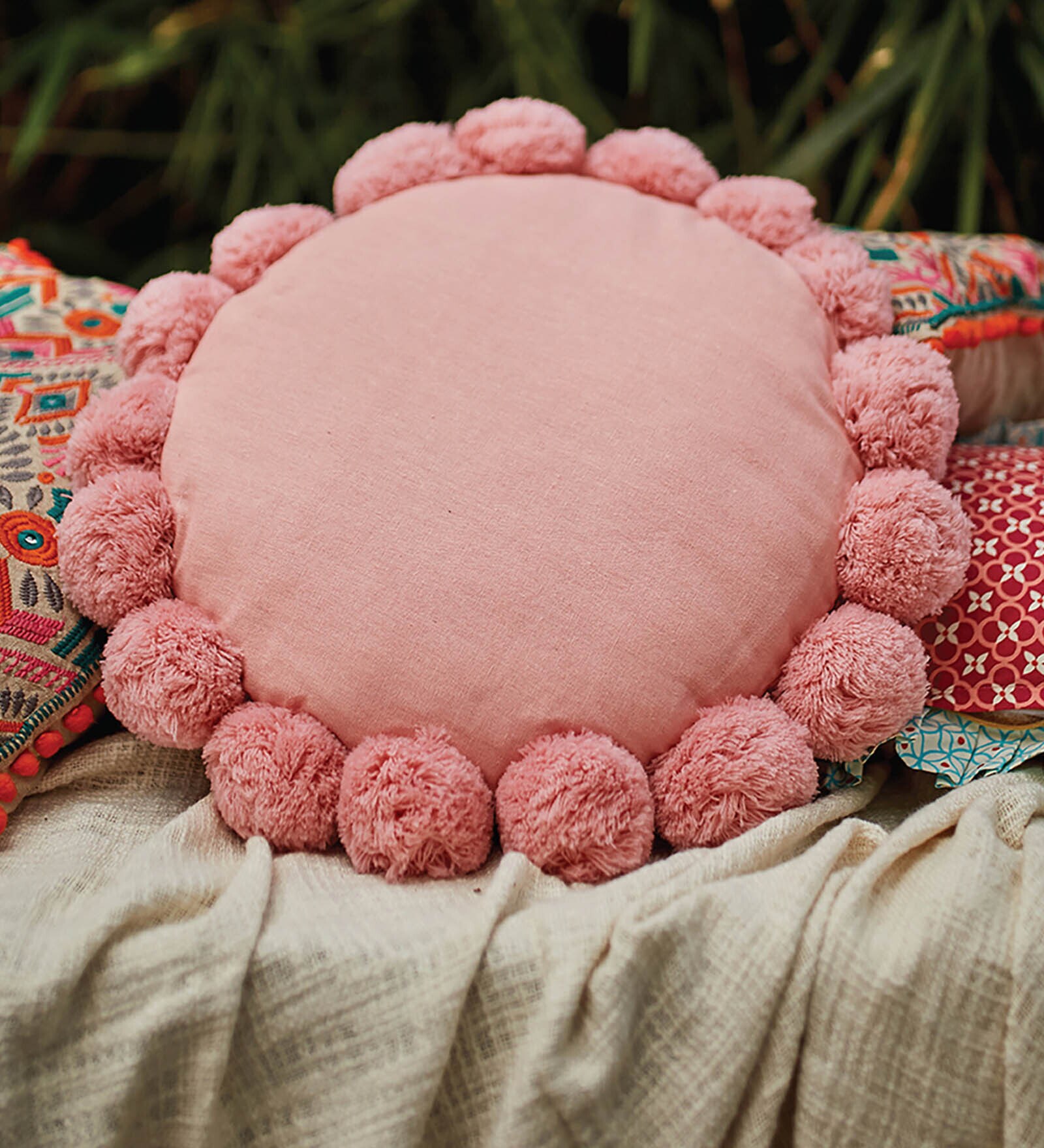 Buy Peach Pom Pom Stuffed Cushion at 5% OFF by Chumbak | Pepperfry