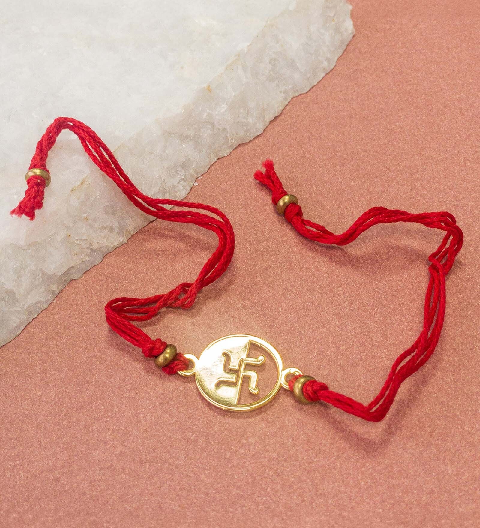 Buy Swastik Rakhi Red Thread at 24% OFF by NestRoots | Pepperfry