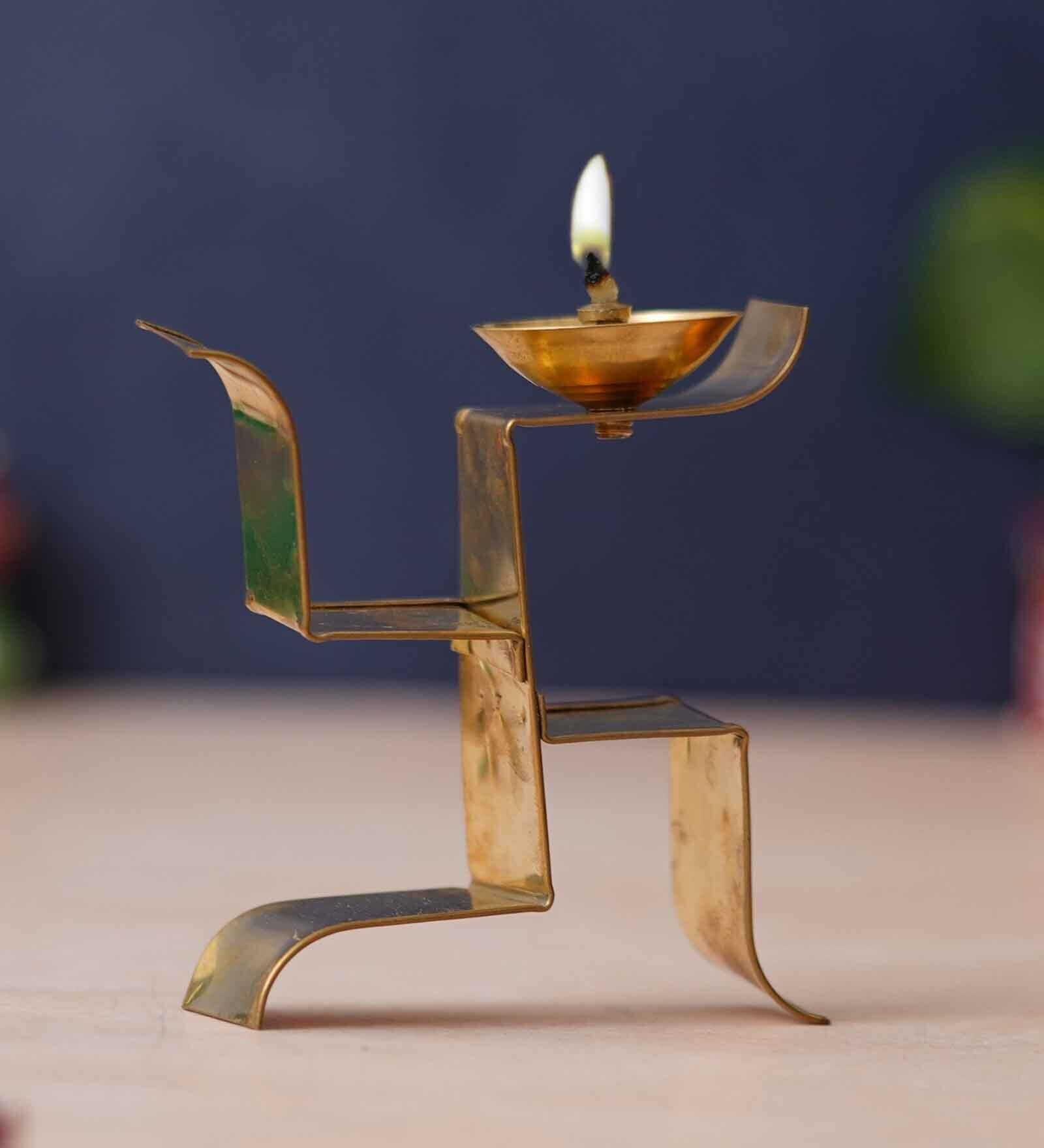 Buy Swastik Symbol Gold Metal Diya at 20% OFF by eCraftIndia | Pepperfry